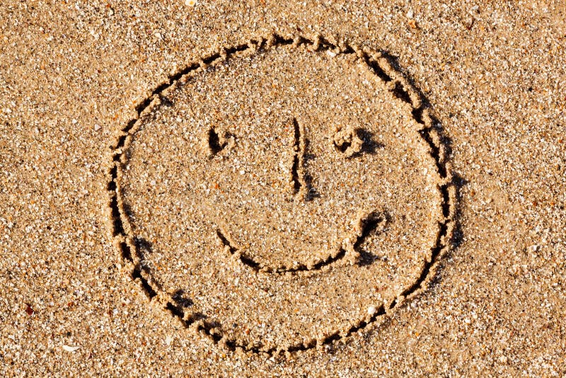 Cheerful Smiley Face in the Sand Stock Photo - Image of paint, screen ...