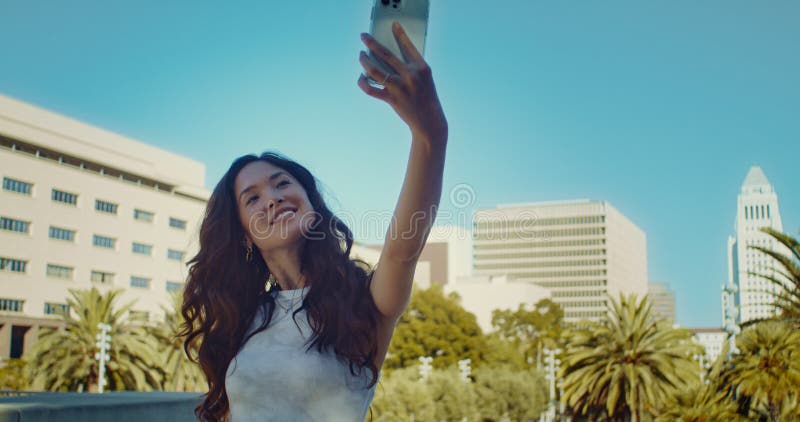 Lady Tourist Looking On Camera Making Selfie Model Posing On City
