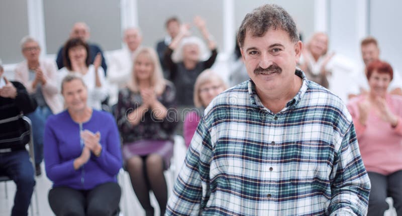 Cheerful Speaker Standing in Conference Hall and Smilling at Camera ...