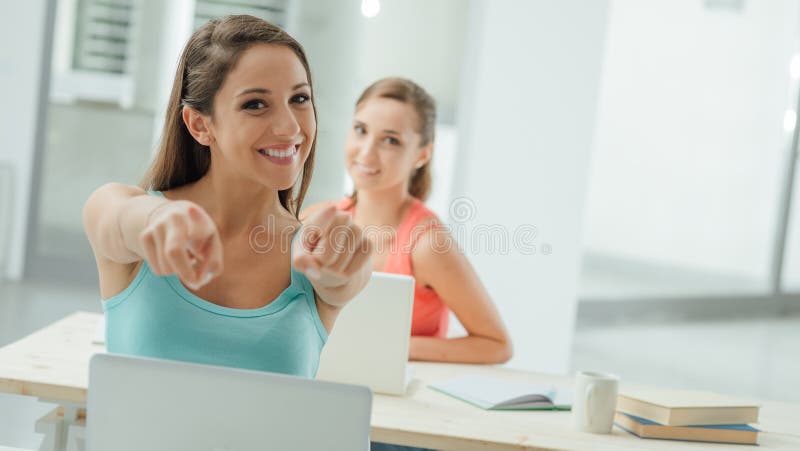 Cheerful Student Pointing at Camera Stock Photo - Image of girl ...
