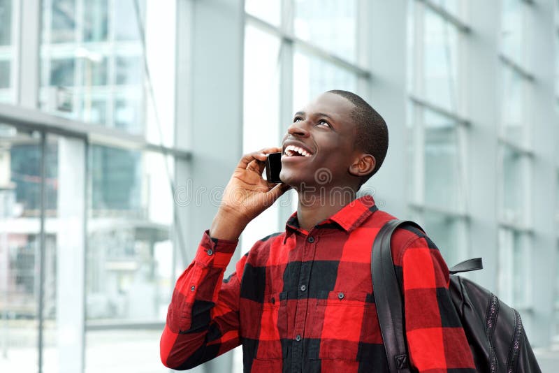 Cheerful Student Talking on Cell Phone at Station Stock Photo - Image ...