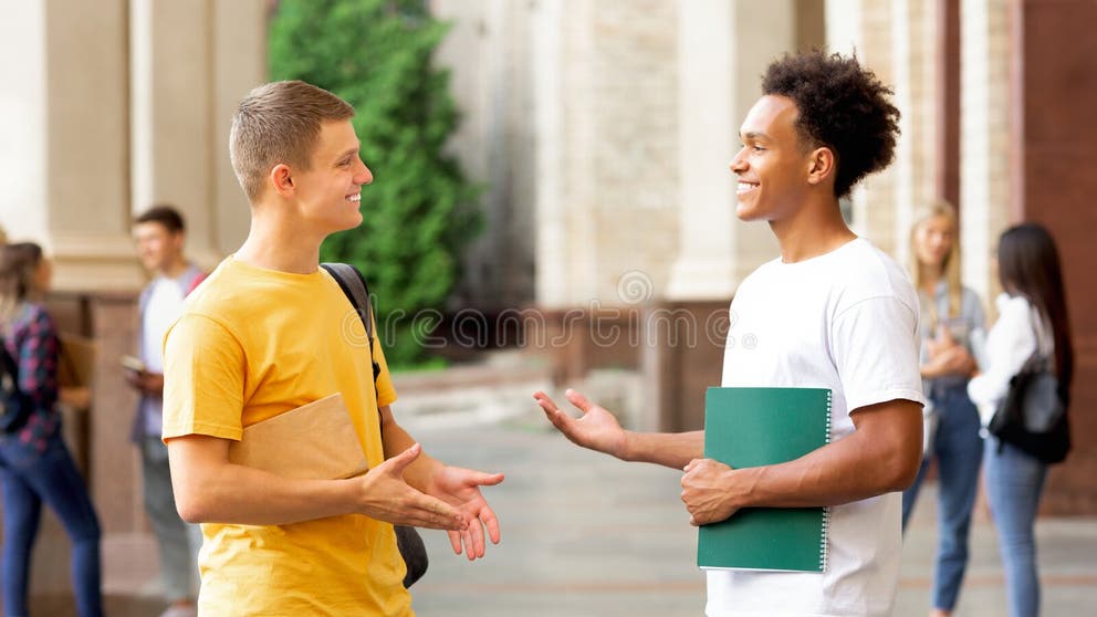 Cheerful Students Discussing Something Outdoors, Having Break Stock ...