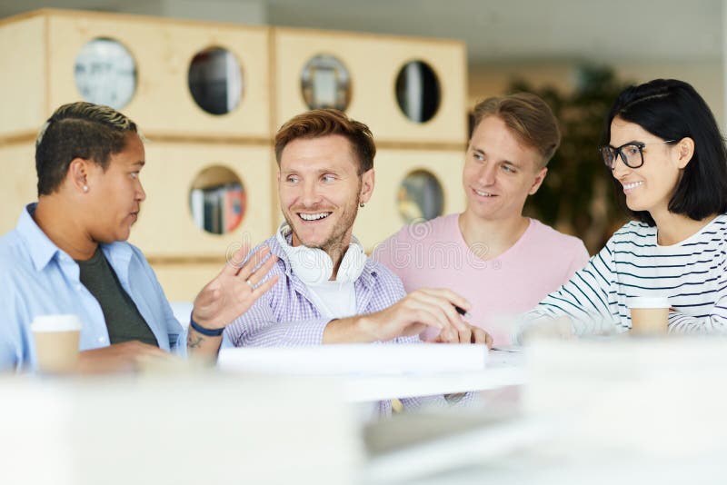 Cheerful Students Exchanging Ideas Stock Photo - Image of university ...