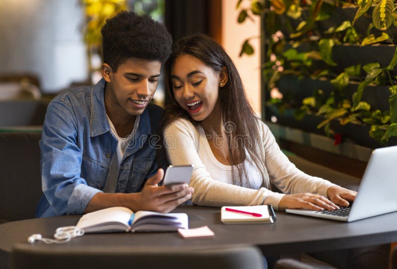 Cheerful Students Using Mobile Application for Studying Stock Image ...