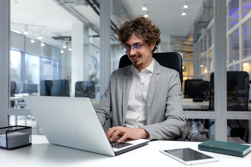 Cheerful and Successful Businessman Inside Office Working with Laptop ... Cheerful and Successful Businessman Inside Office Working with Laptop ...
