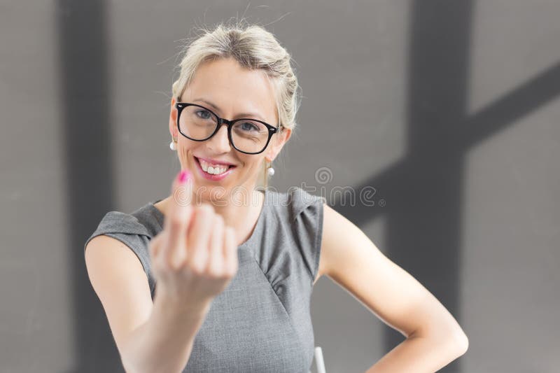 Cheerful Teacher Inviting Students To Her Class Stock Photo - Image of ...