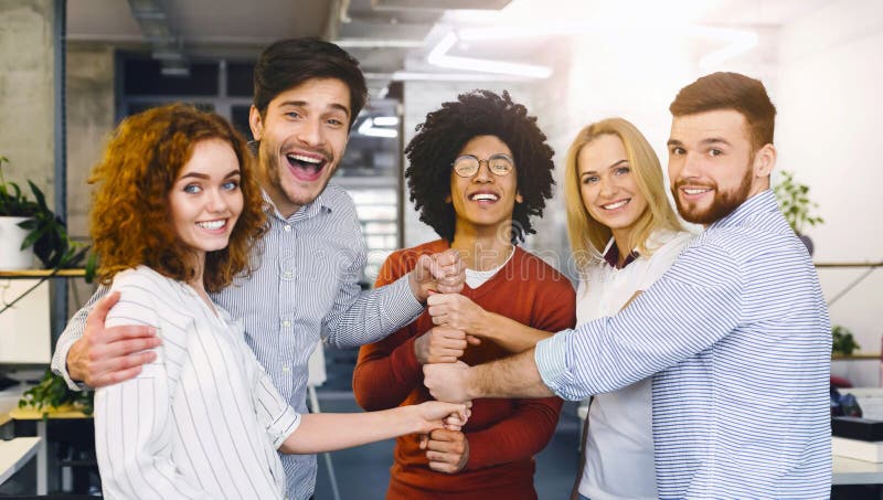 Cheerful Team Celebrating Success in Modern Office Environment during ...