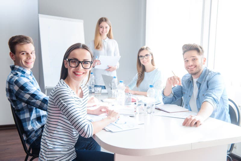 Cheerful Team Standing on the Table Stock Photo - Image of daytime ...