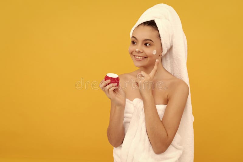 Cheerful Teen Girl In Shower Towel Apply Facial Cream Stock Image