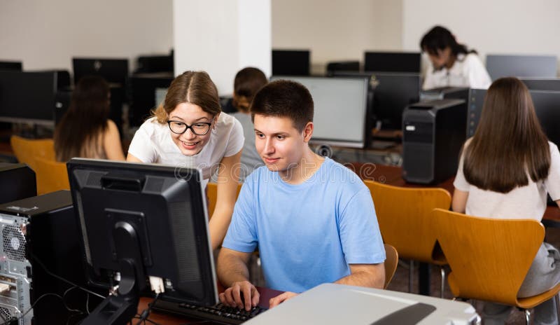 Cheerful Teenager Boy and Girl Studying in Computer Class Stock Photo ... Cheerful Teenager Boy and Girl Studying in Computer Class Stock Photo ...