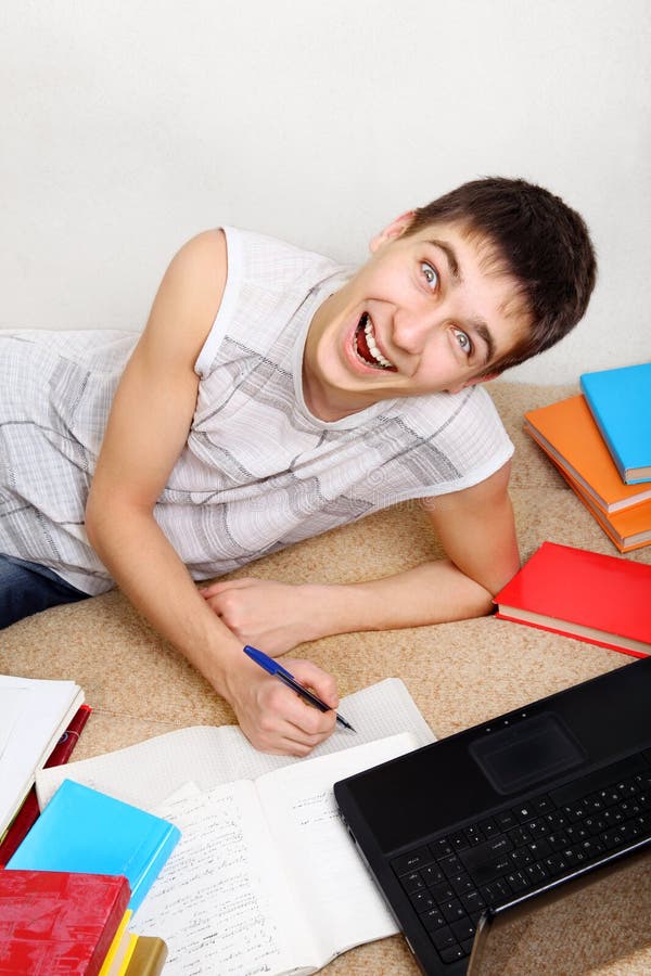 Cheerful Teenager Doing Homework Stock Photo - Image of home, device ...