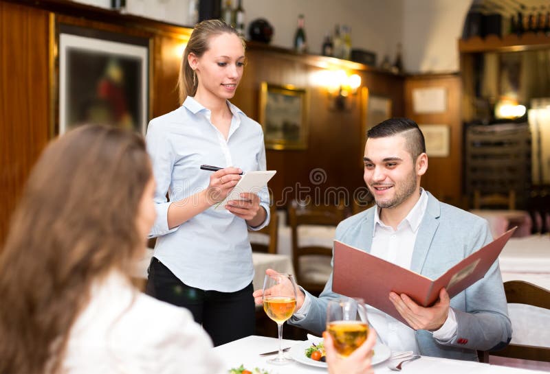 Cheerful Waitress Taking a Table Order Stock Image - Image of friends ...