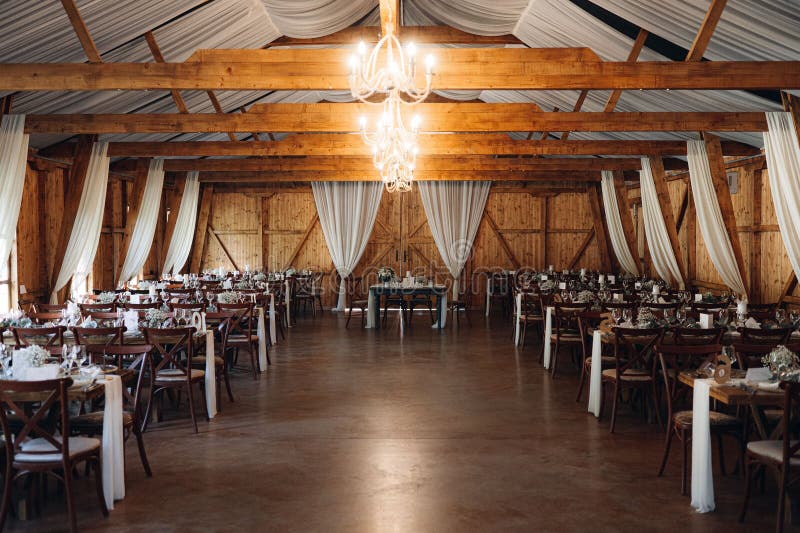 Cheerful Wedding Reception Taking Place in a Rustic Barn Setting. Stock ...