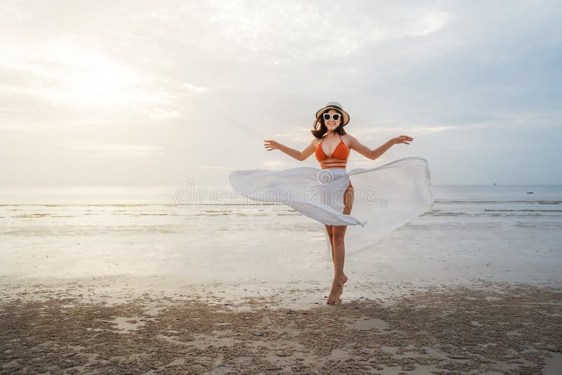 Cheerful Woman In Bikini Enjoying On Sea Beach With Sunlight Stock
