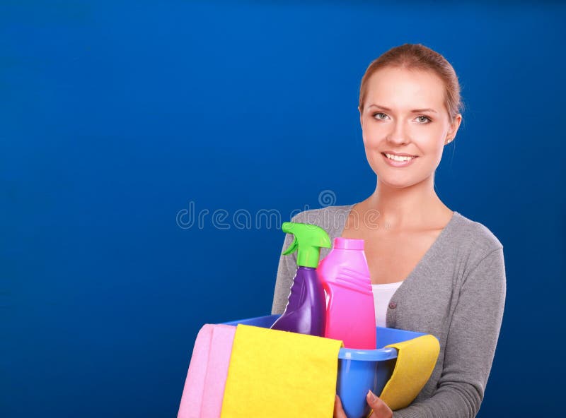 Cheerful Woman is Cleaning Something with Wisp and Spray Attentively ...