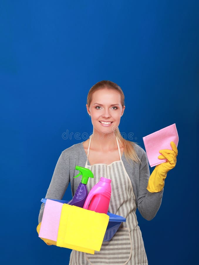 Cheerful Woman is Cleaning Something with Wisp and Spray Attentively ...