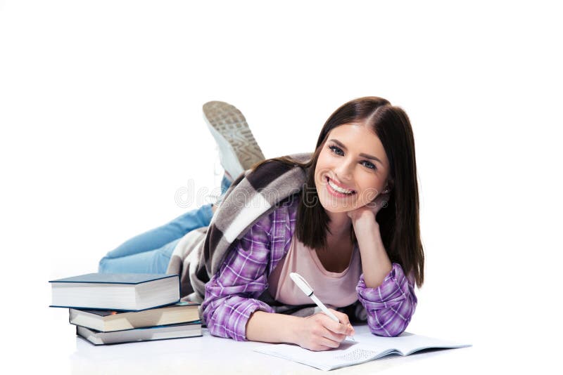 Cheerful Woman Lying On The Floor And Writing In Notebook Stock Photo ...