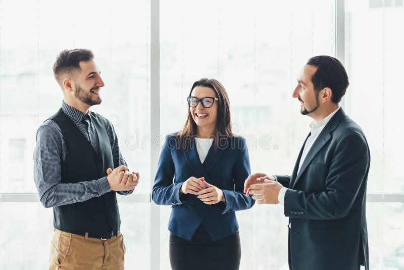 Cheerful Work Team during Break Time in Office, Chatting Lively. Stock ...