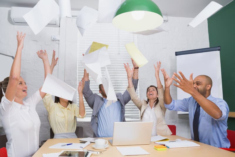 Cheerful Workers Throwing Paper and Smiling Stock Photo - Image of ...
