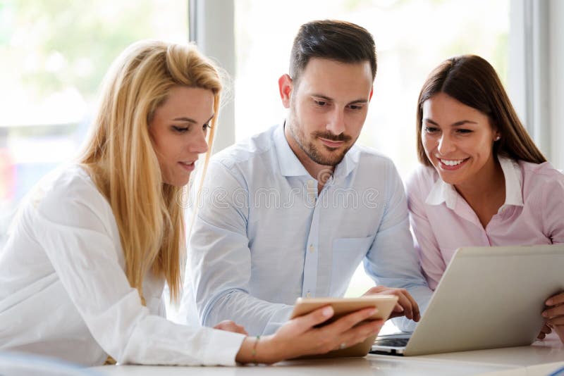 Workteam in Office Working Together on Laptop Stock Image - Image of ...