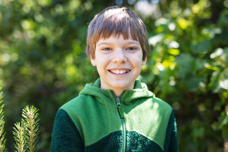 Cheerful Young Boy Looking at Camera Outdoors Stock Photo - Image of ...
