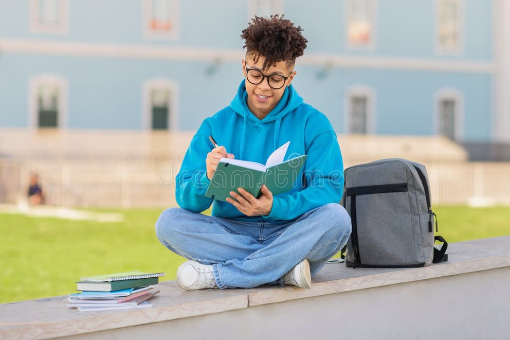 Cheerful Young Brazilian Student Guy Taking Notes Learning Outside ...