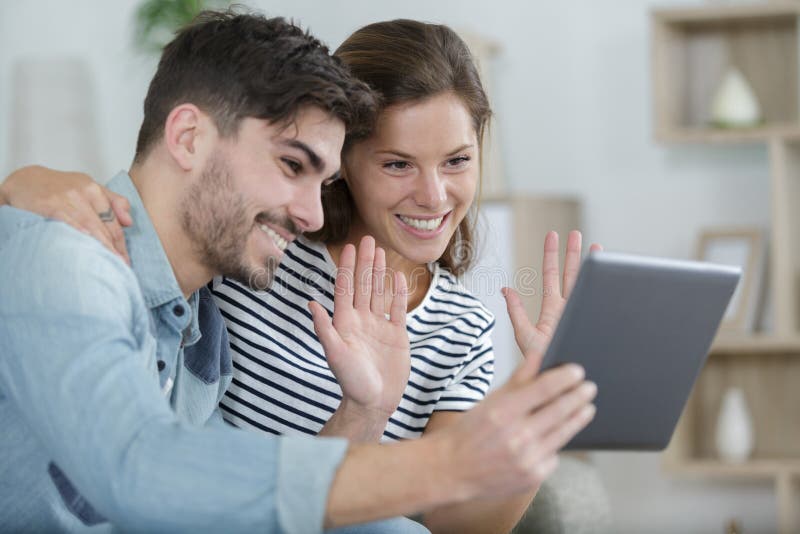 Cheerful Young Couple Having Video Call Stock Photo - Image of laughing ...