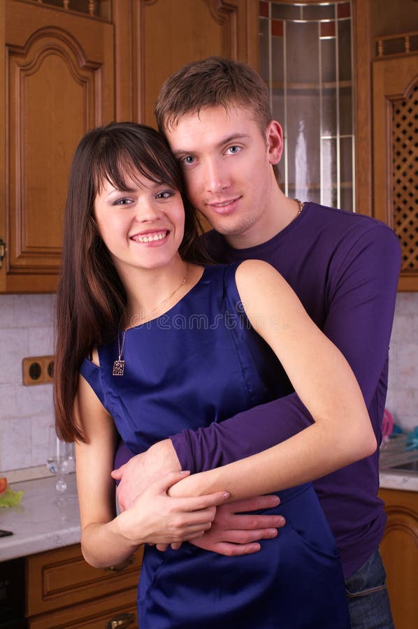 Cheerful Young Couple at Home Stock Photo - Image of green, happiness ...