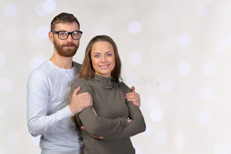 Cheerful young couple stock photo. Image of embracing - 68306390