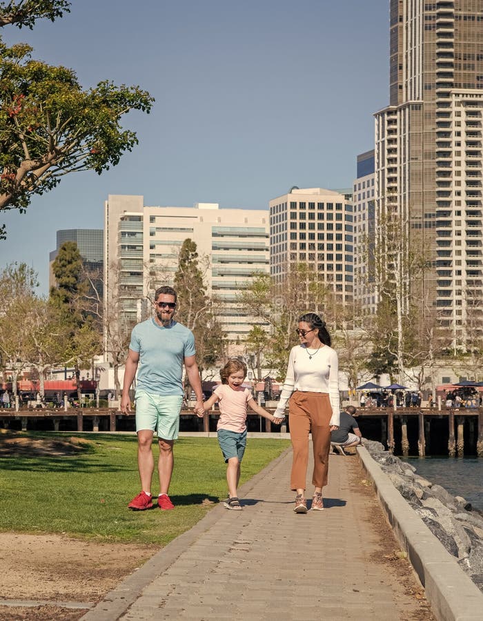Cheerful Young Family Walk in Park with Son, Parenthood Stock Photo ...