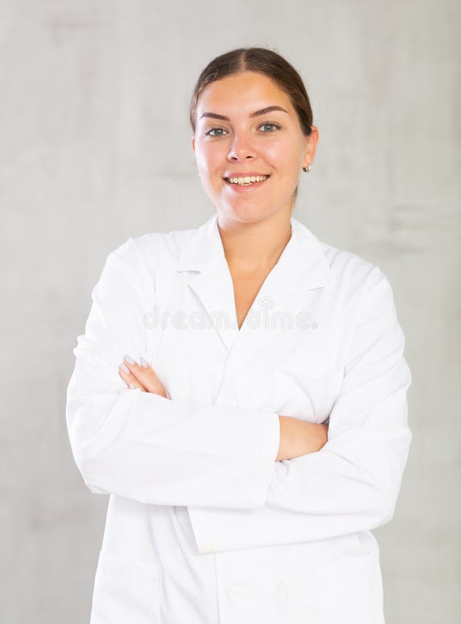 Happy Young Female Doctor Standing and Smiling Proud of Her Job Stock ... Happy Young Female Doctor Standing and Smiling Proud of Her Job Stock ...