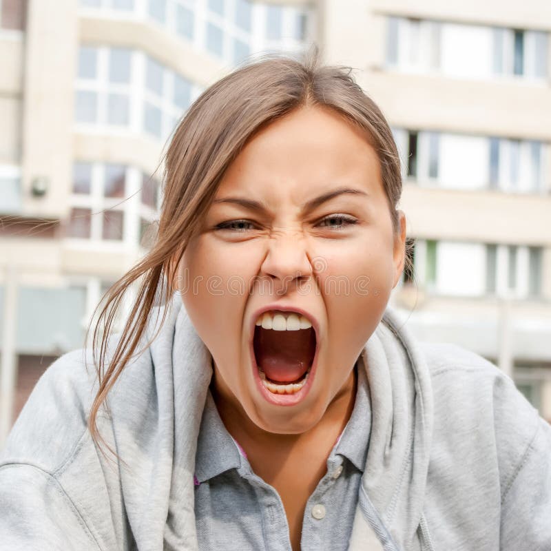 Cheerful Young Girl. Makes a Funny Facial Expression Stock Image ...