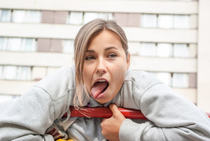 Cheerful Young Girl. Makes a Funny Facial Expression Stock Image ...