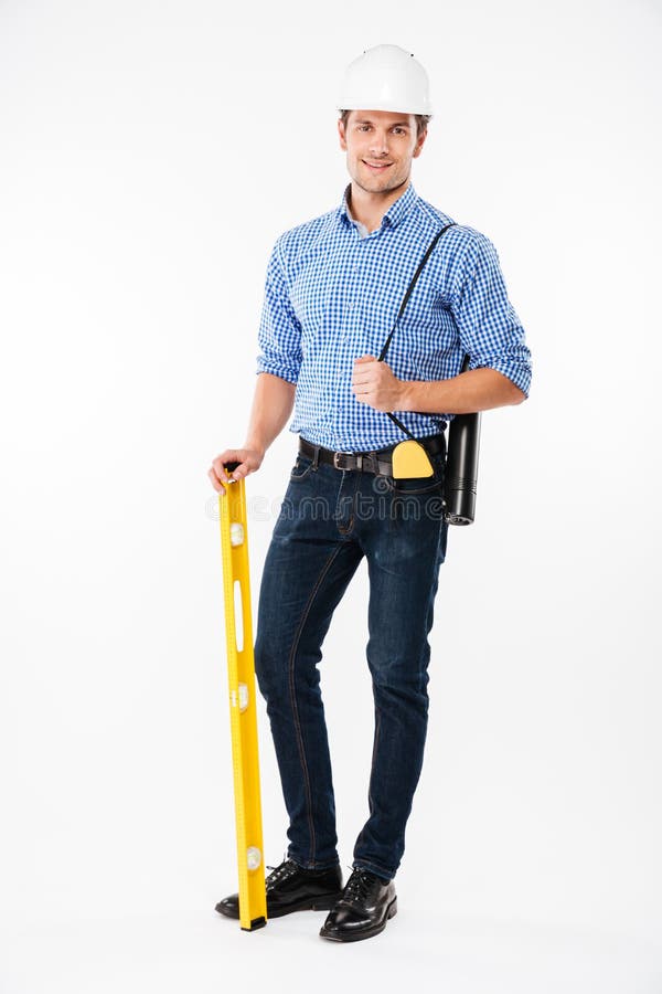 Cheerful Young Man Builder in Hard Hat Holding Spirit Level Stock Photo ...
