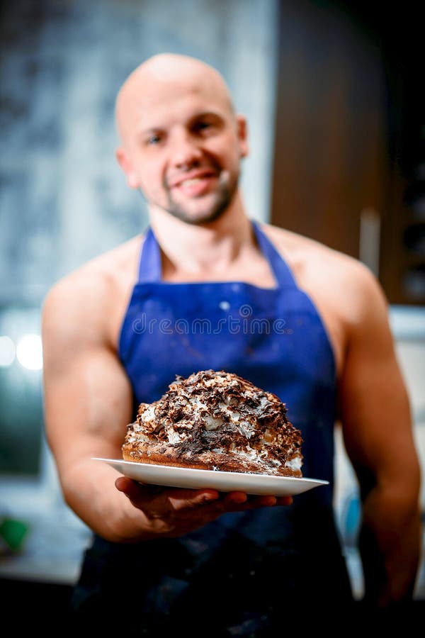 Cheerful Young Man with a Cake Stock Photo - Image of kitchen, food ...