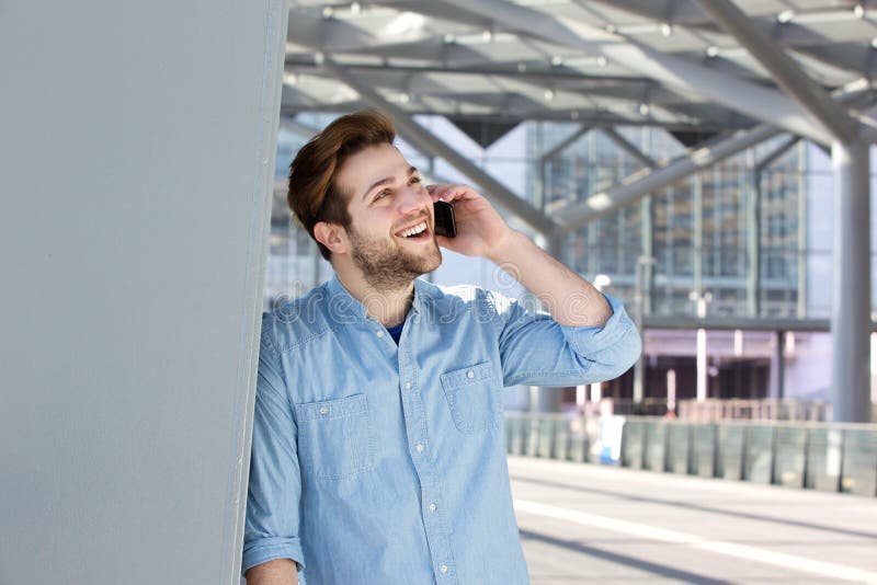 Cheerful Young Man Calling with Cell Phone Stock Image - Image of ...
