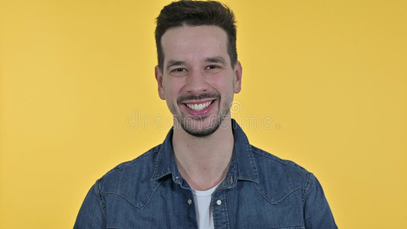 Cheerful Young Man Saying Yes by Shaking Head, Yellow Background Stock ...