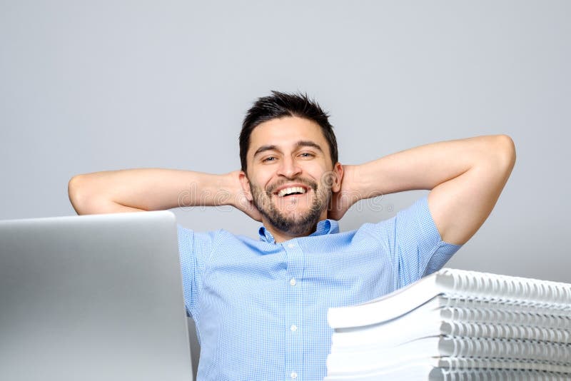Cheerful Young Man Sitting at the Table with Laptop Stock Photo - Image ...