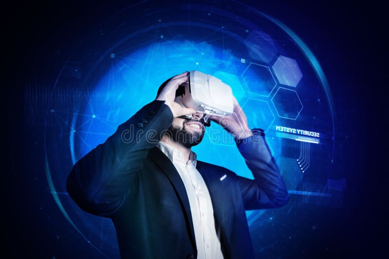 Cheerful Young Man Smiling while Putting on Virtual Reality Glasses ... Cheerful Young Man Smiling while Putting on Virtual Reality Glasses ...