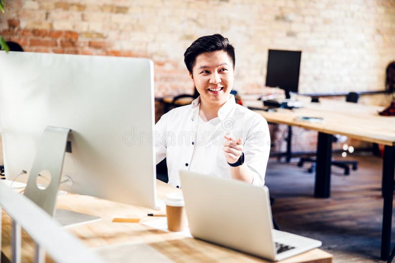 Cheerful Young Man Using Modern Computer at Work Stock Photo - Image of ...