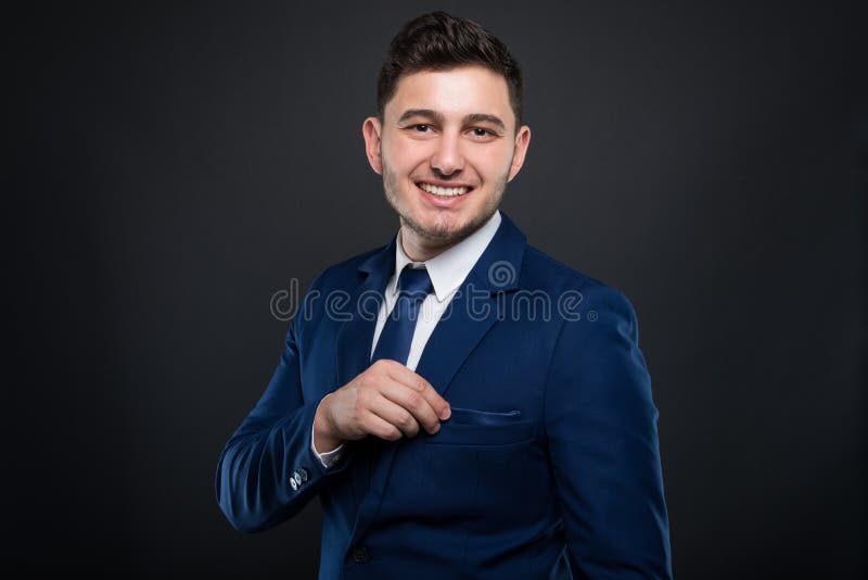 Cheerful Young Manager Adjusts His Suit Pocket Stock Photo - Image of ...