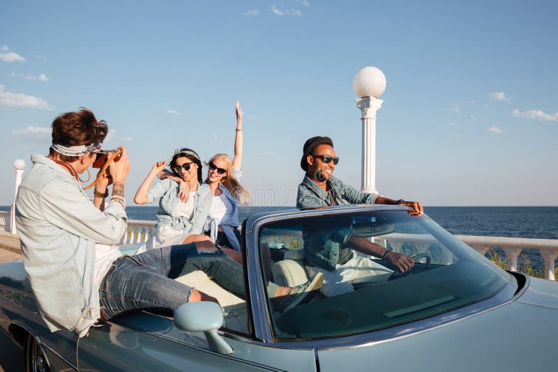 Cheerful Young People Driving a Car and Talking Photos Stock Photo ...