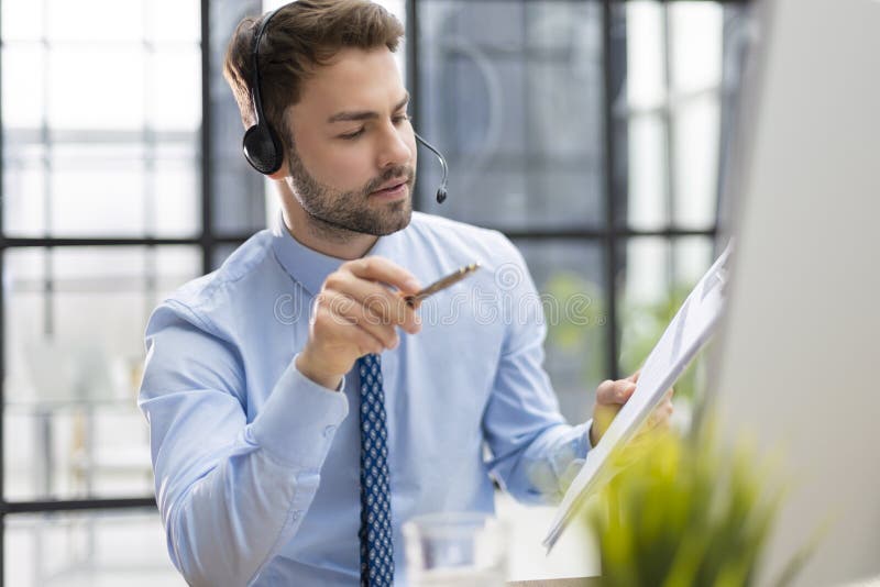 Cheerful Young Support Phone Male Operator in Headset, at Workplace ...