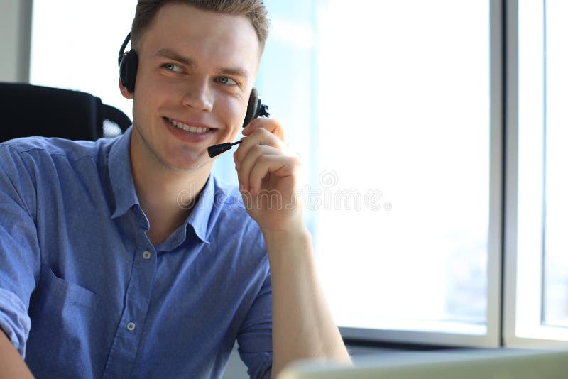 Cheerful Young Support Phone Male Operator in Headset, at Workplace ...