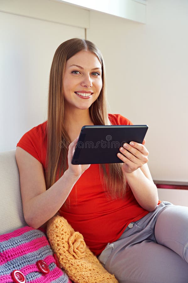 Woman Holding the Tablet Pc and Smiling Stock Photo - Image of ...