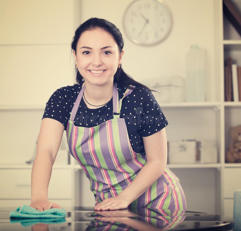 Cheerful Young Woman Wiping Table Stock Photo - Image of dusting ...