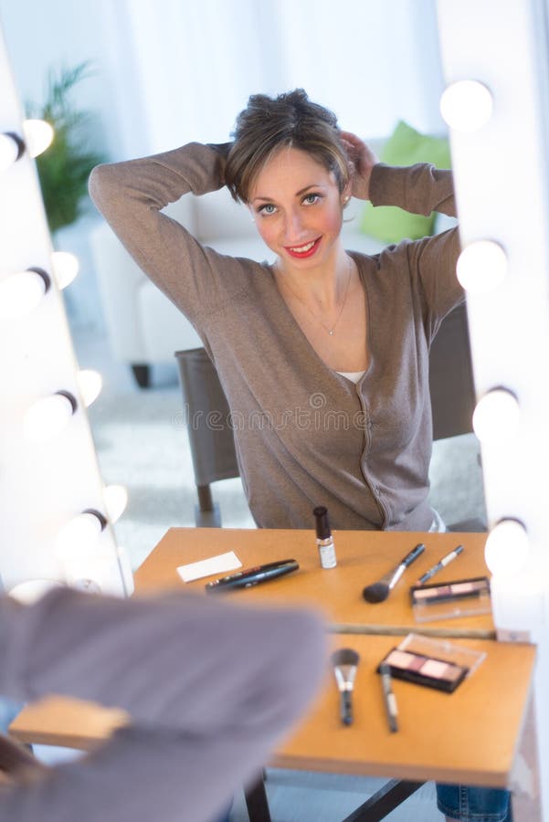 Cheerful Young Women Adjusting Her Make-up Stock Image - Image of ...