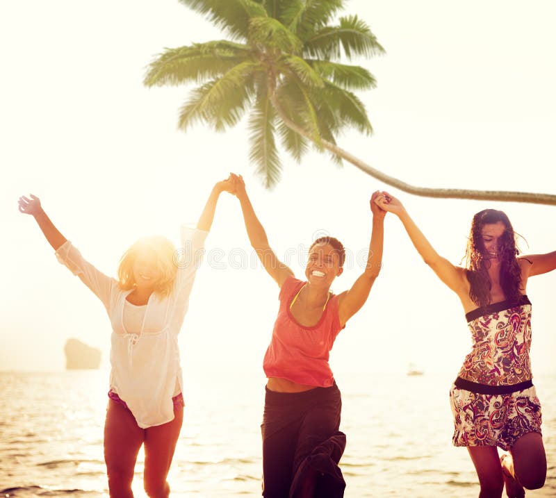 Cheerful Young Women Celebrating by the Beach Stock Image - Image of ...
