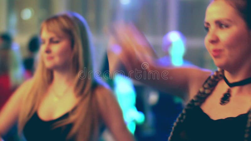 Cheerful Young Women Dancing And Singing At A Birthday Party Stock