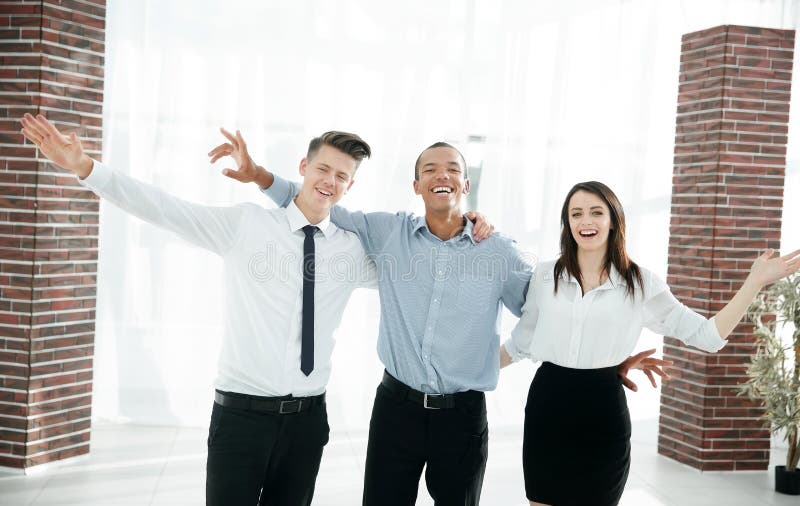 Cheering Business Team in the Background of the Office Stock Photo ...